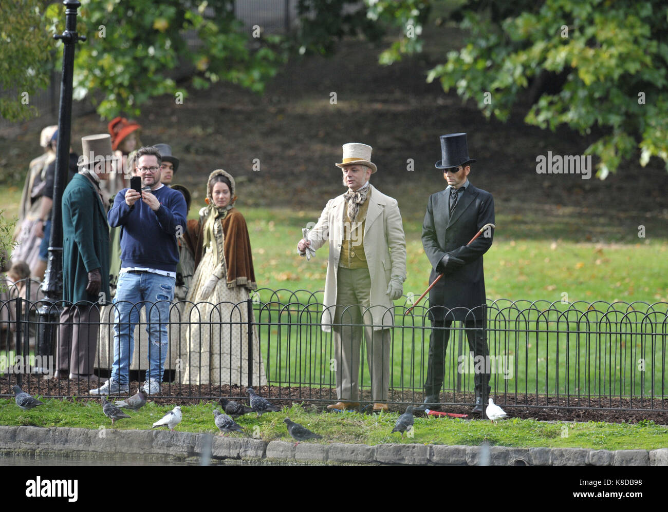 Michael Sheen with co-star David Tennant (right) during filming for ...