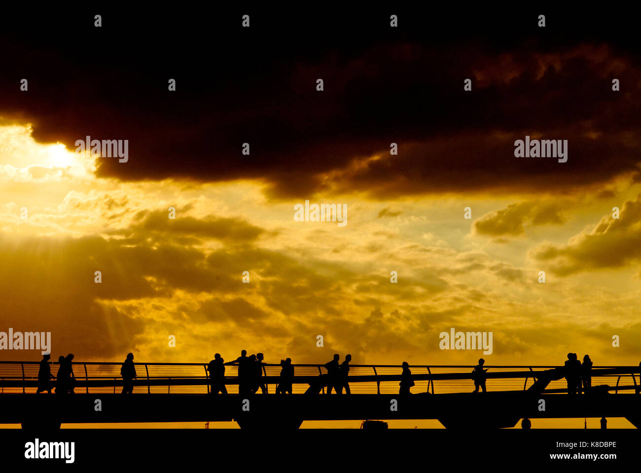 Sunset over the Millennium Bridge, River Thames, London, Britain Stock ...