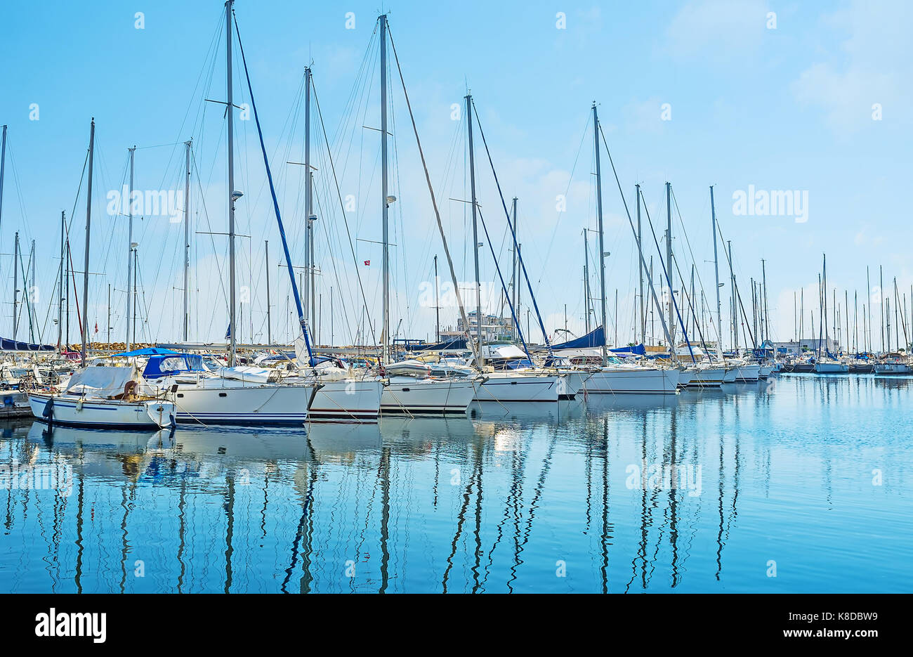 The row of modern white sail yachts, moored in modern marina of resort ...