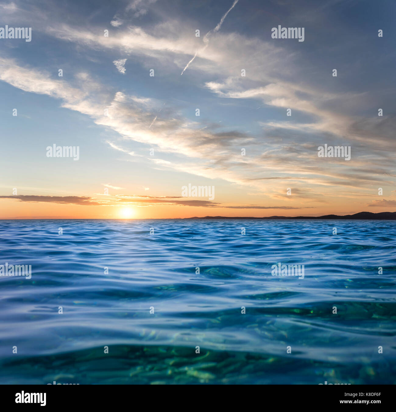 Sundet and sky with clouds over the sea or ocean Stock Photo - Alamy