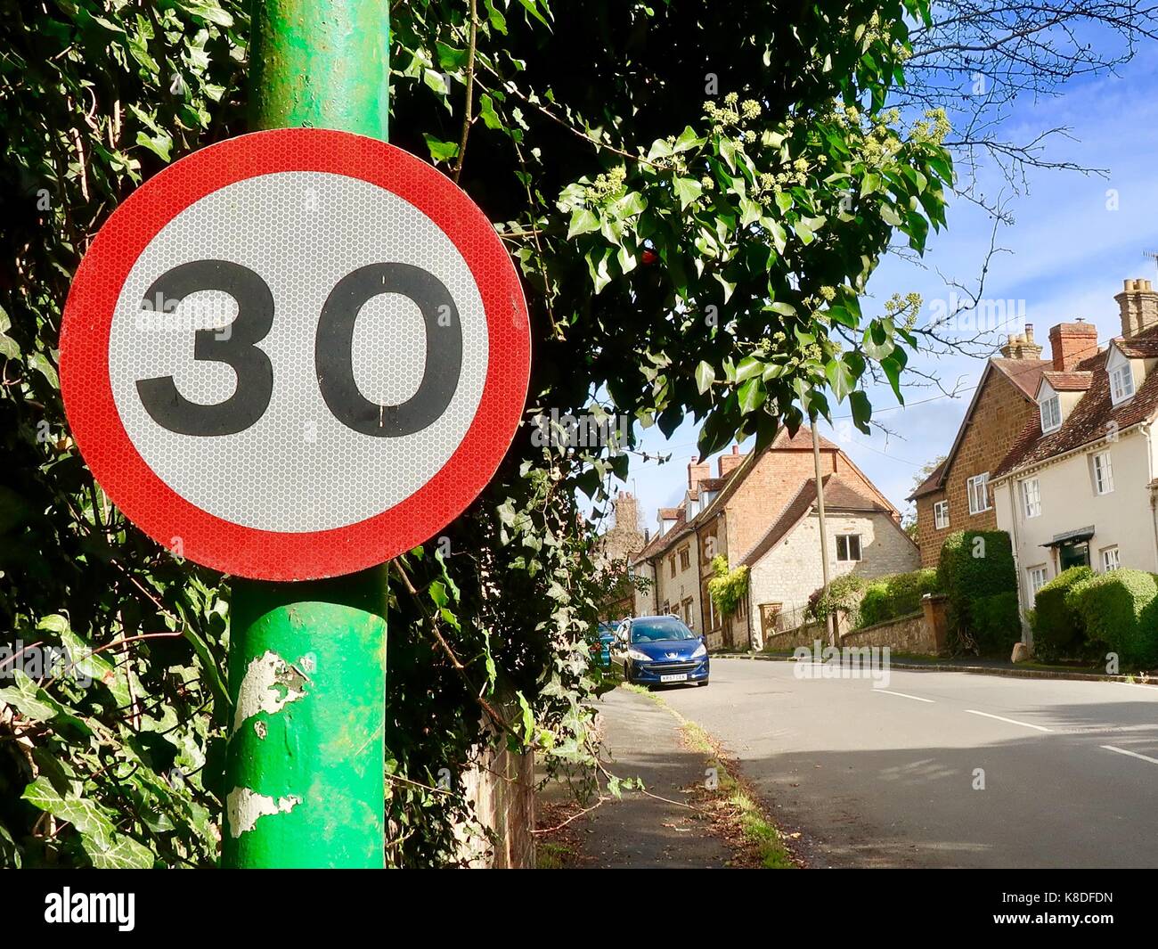 30 MPH speed limit sign on a green post in Kineton, Warwickshire, UK ...