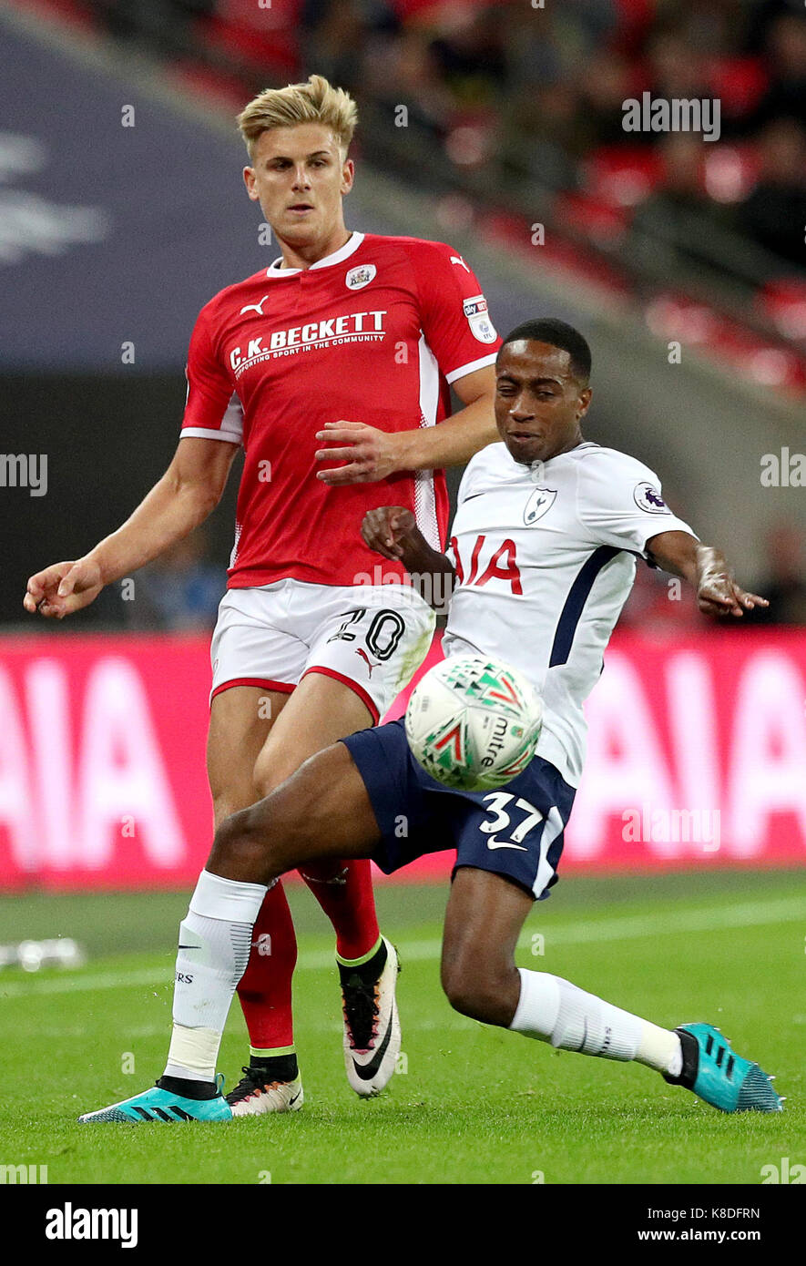 Barnsley's Brad Potts (left) and Tottenham Hotspur's Kyle Walker-Peters ...
