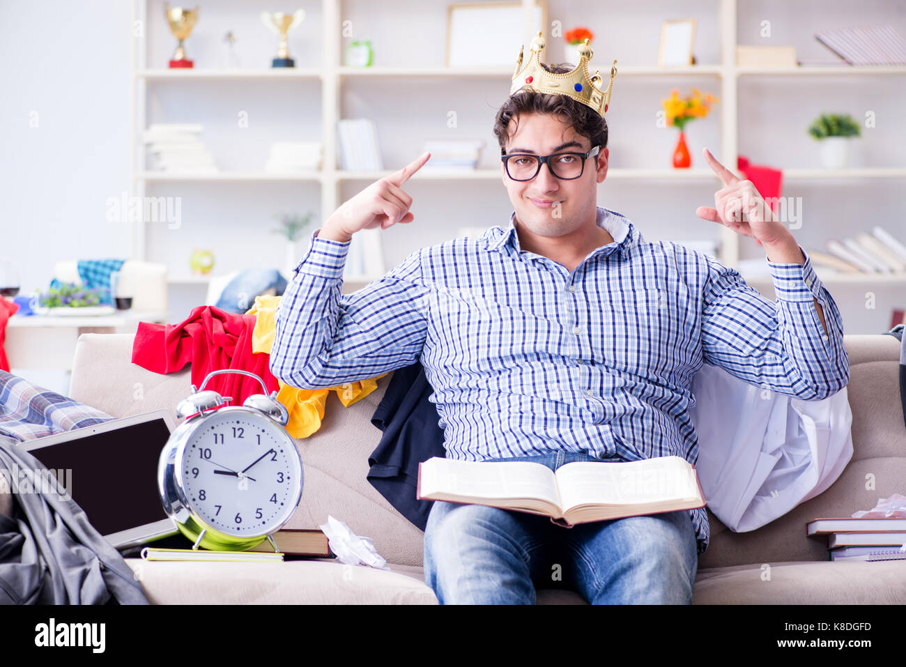 Young man working studying in messy room Stock Photo - Alamy