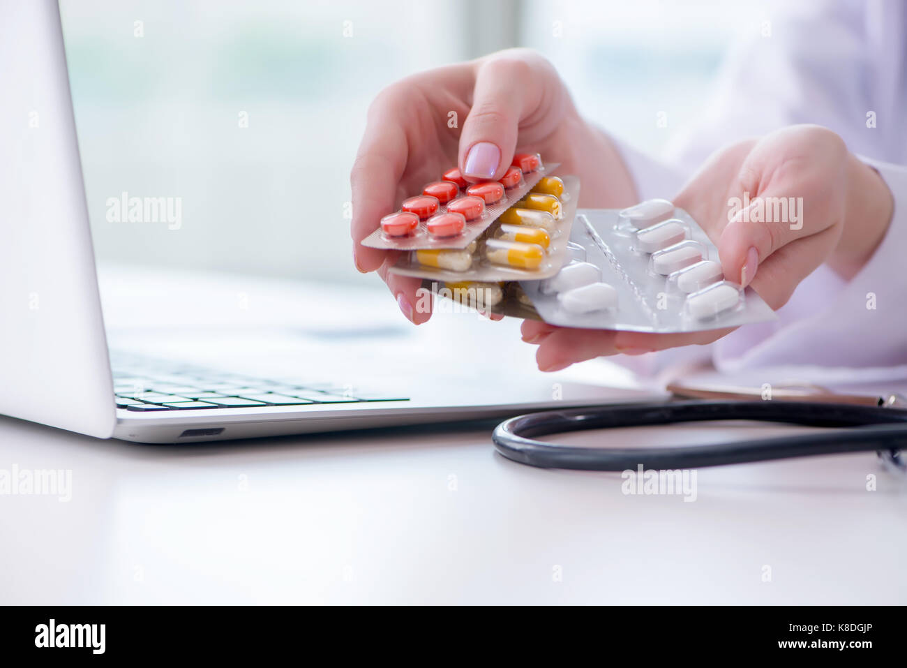 Medical concept with medicines and laptop computer Stock Photo - Alamy