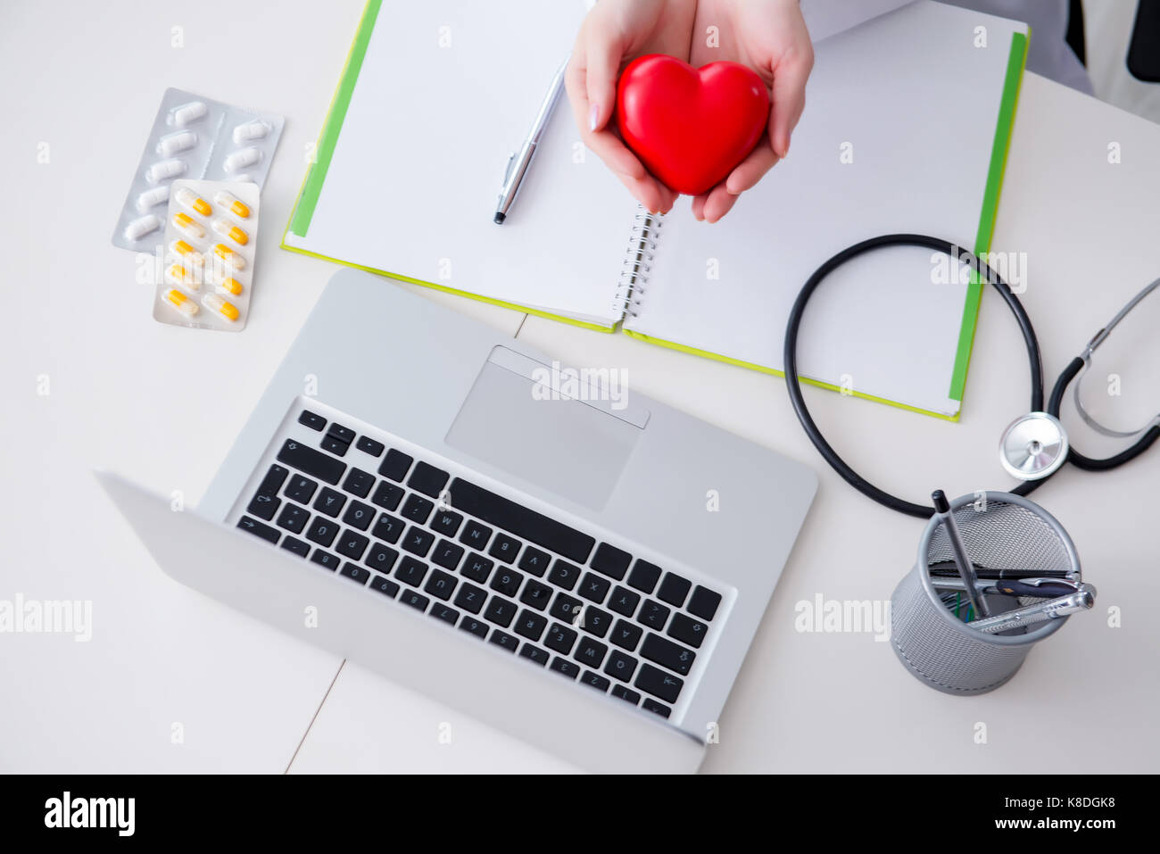 Doctor checking up heart in medical concept Stock Photo - Alamy