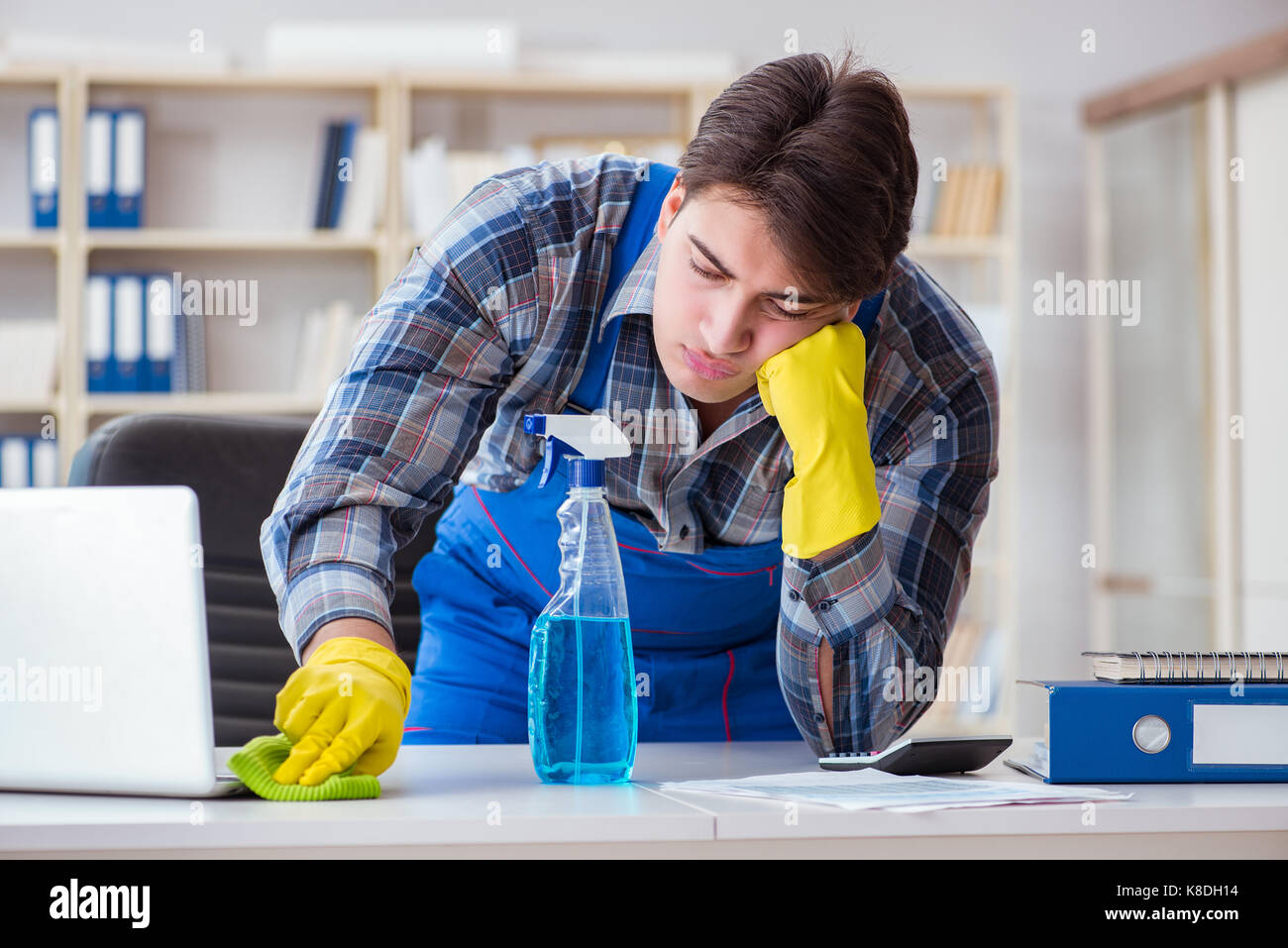 Male cleaner working in the office Stock Photo - Alamy