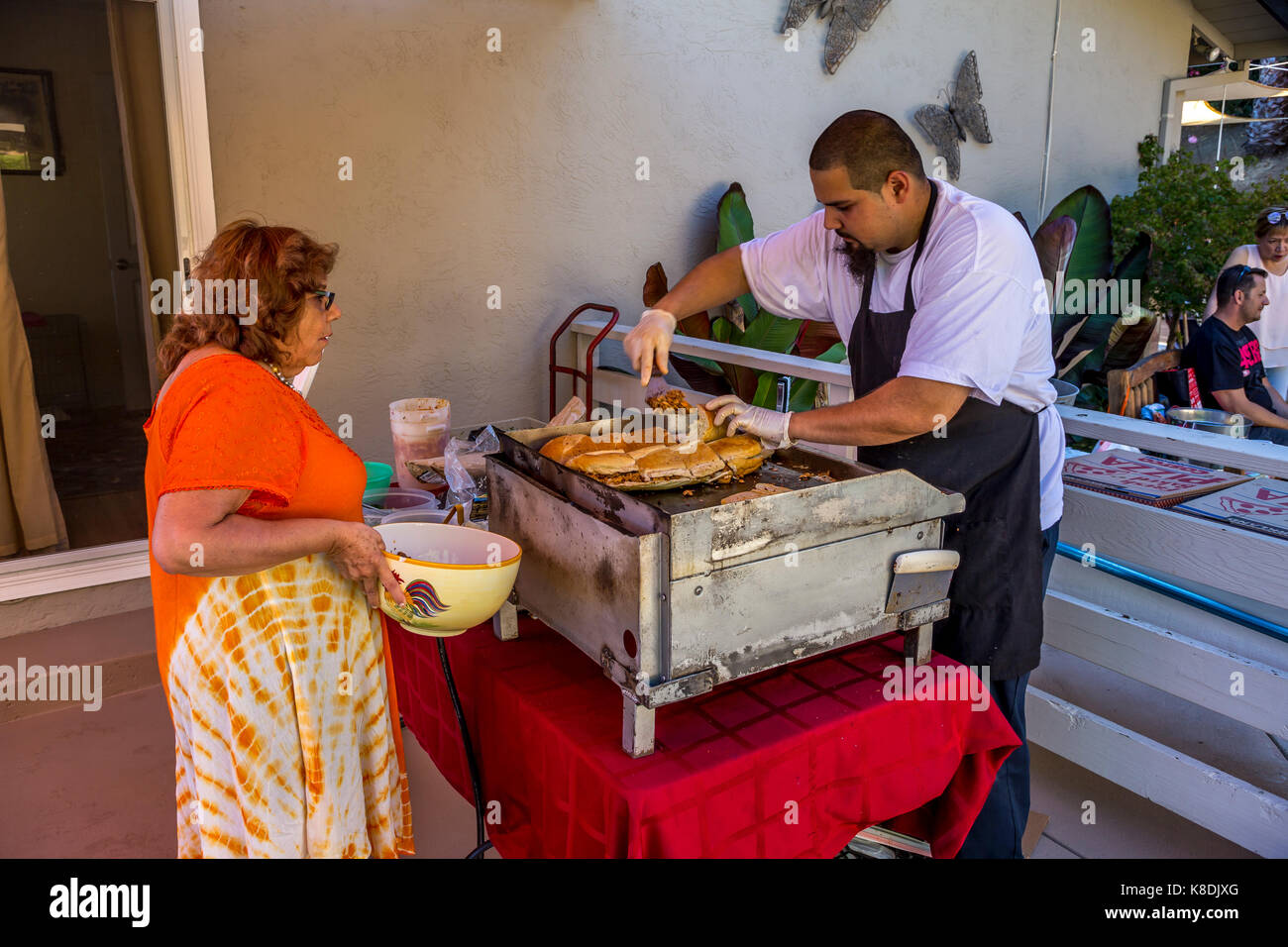 Hispanic man, cook, cooking on flat top grill, grilling meat, grilling ... Hispanic man, cook, cooking on flat top grill, grilling meat, grilling ...