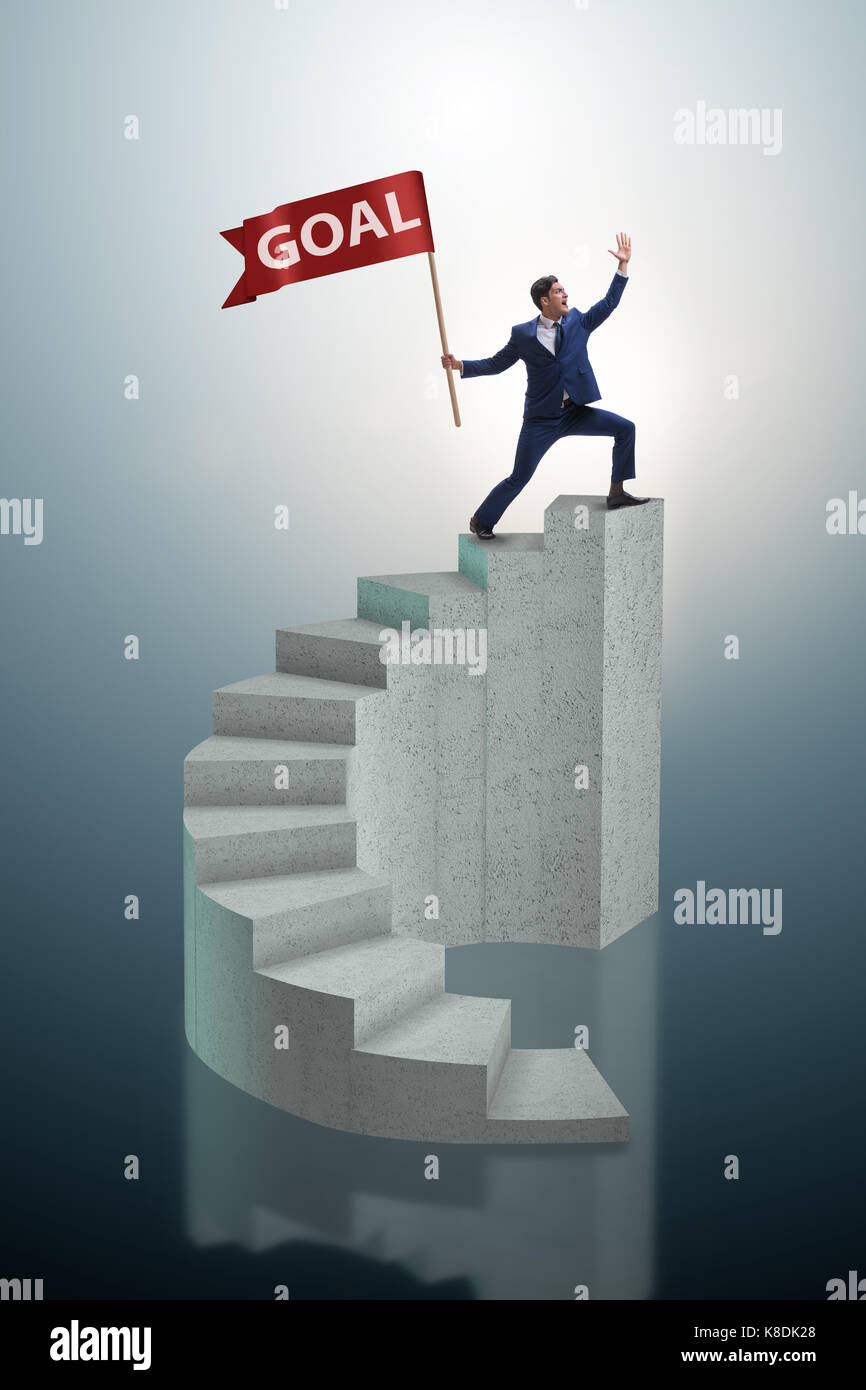 Businessman achieving his business goal objective Stock Photo - Alamy