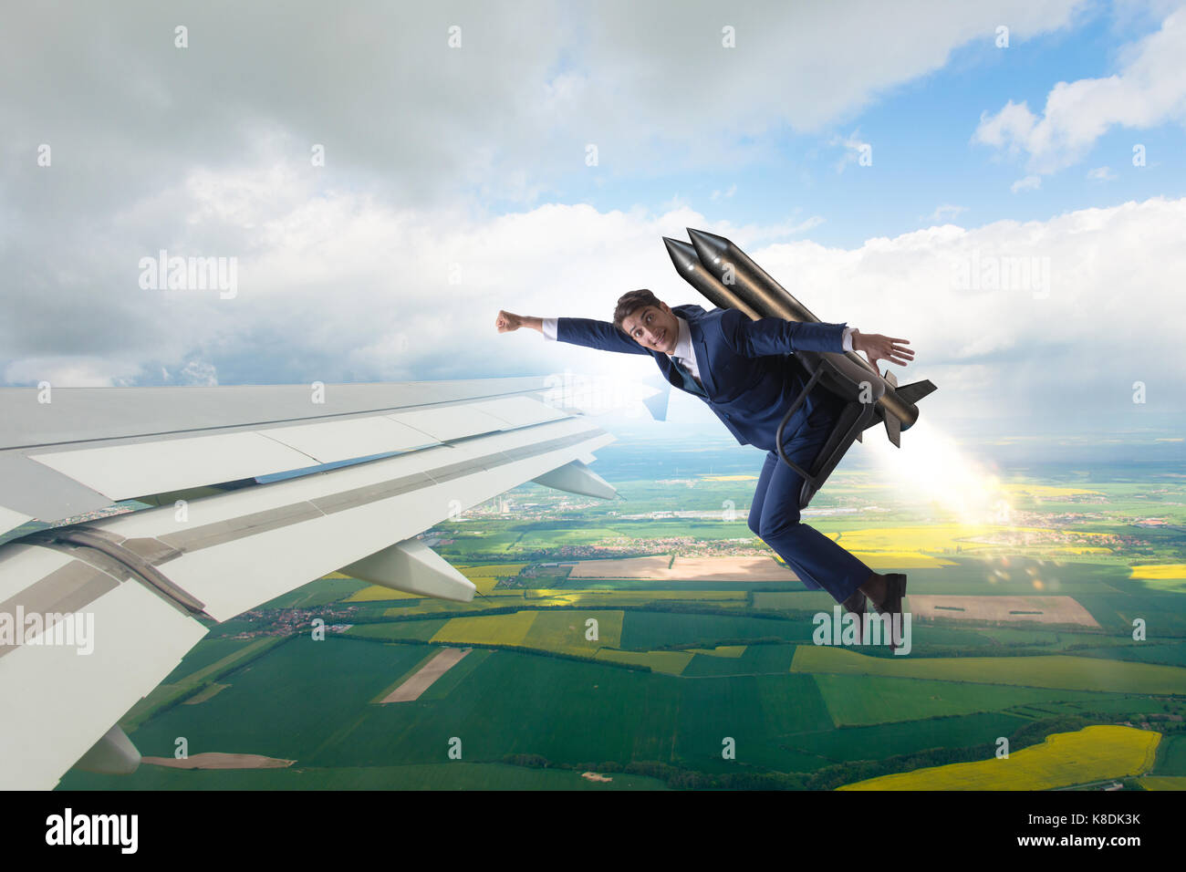 Businessman flying next to commercial flight Stock Photo - Alamy
