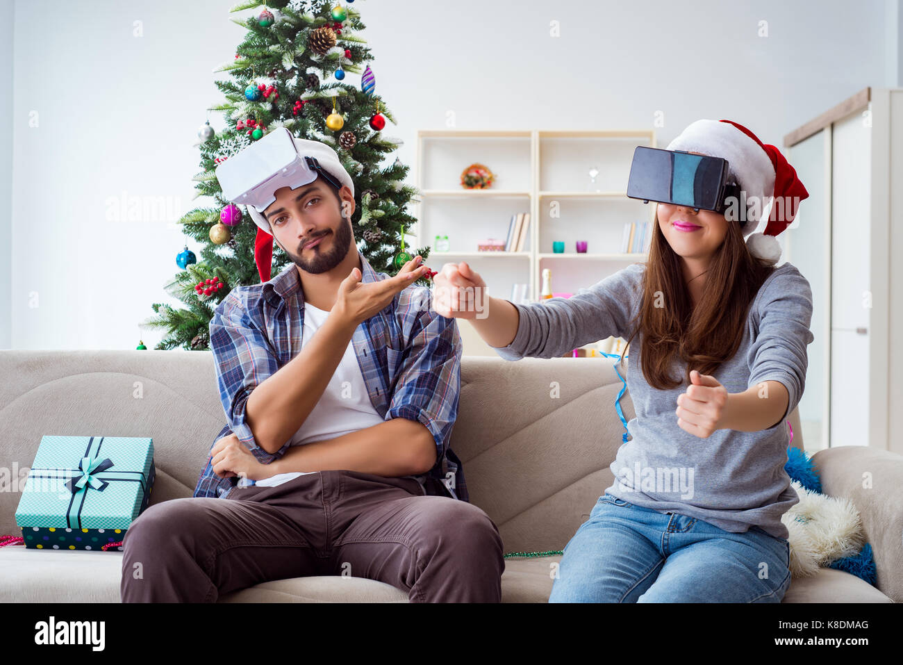 Happy family using virtual reality VR glasses during christmas Stock ...
