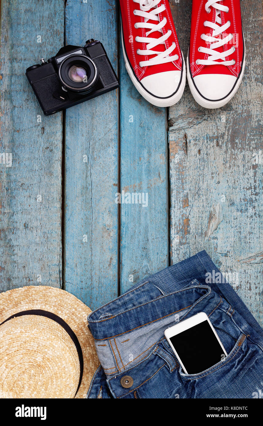 Still life of various items for recreation, clothing, hat, sneakers ...