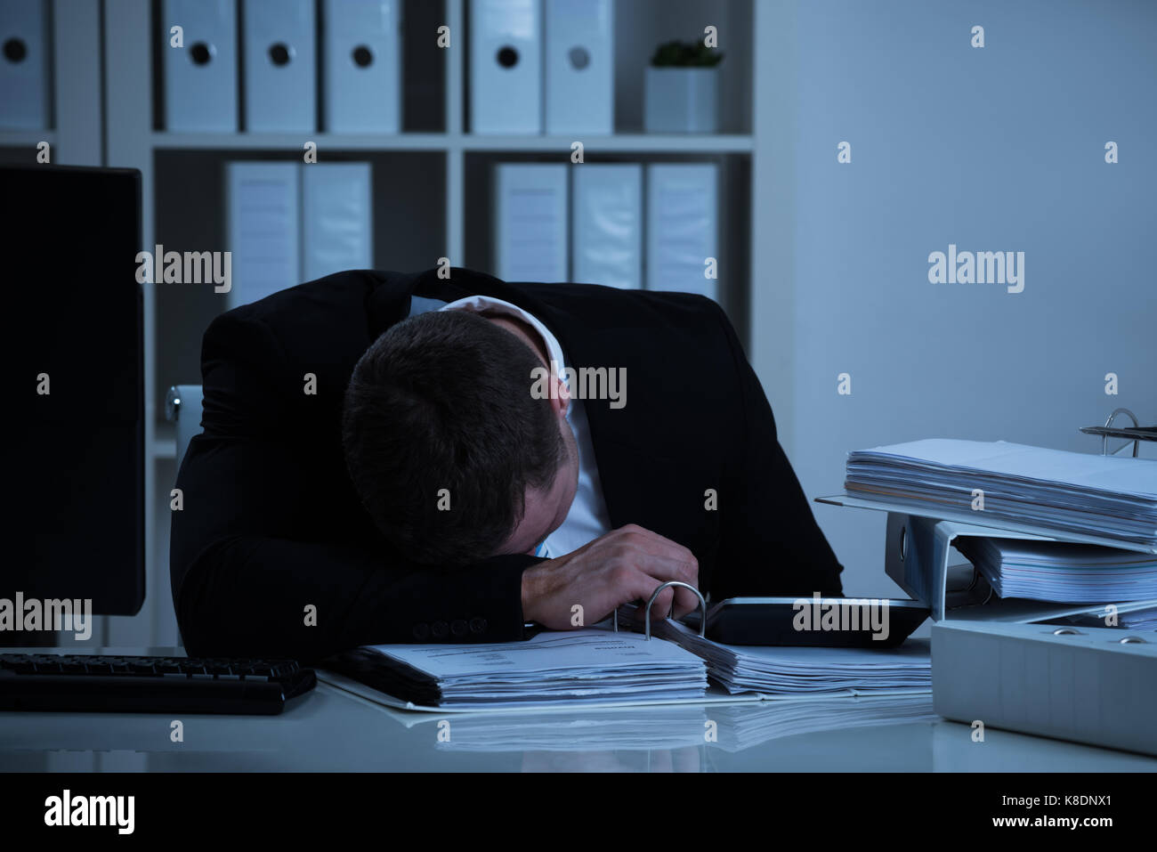 Tired businessman sleeping head on hi-res stock photography and images ...