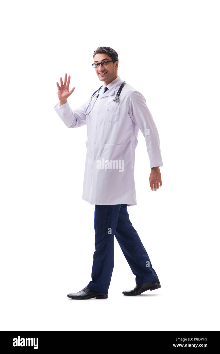 Young doctor physician standing walking isolated on white background ...