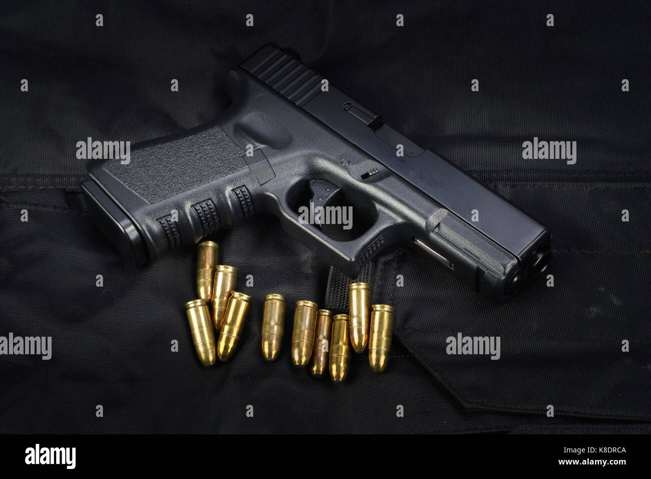 Police weapon and equipment on black uniform background Stock Photo - Alamy