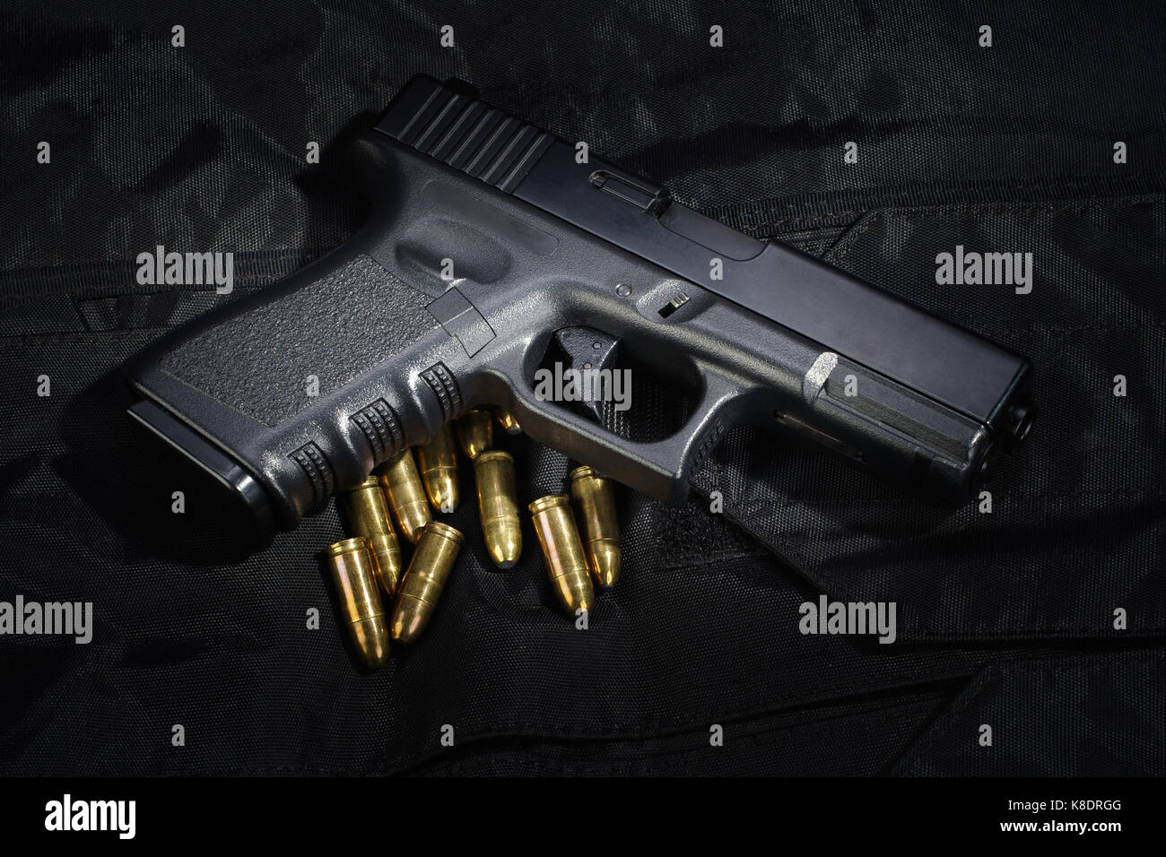 Police weapon and equipment on black uniform background Stock Photo - Alamy