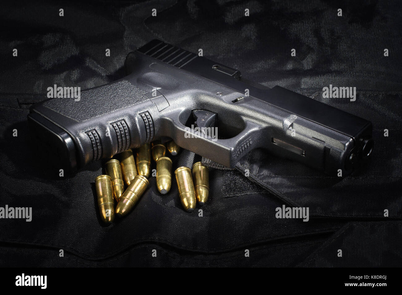 Police weapon and equipment on black uniform background Stock Photo - Alamy