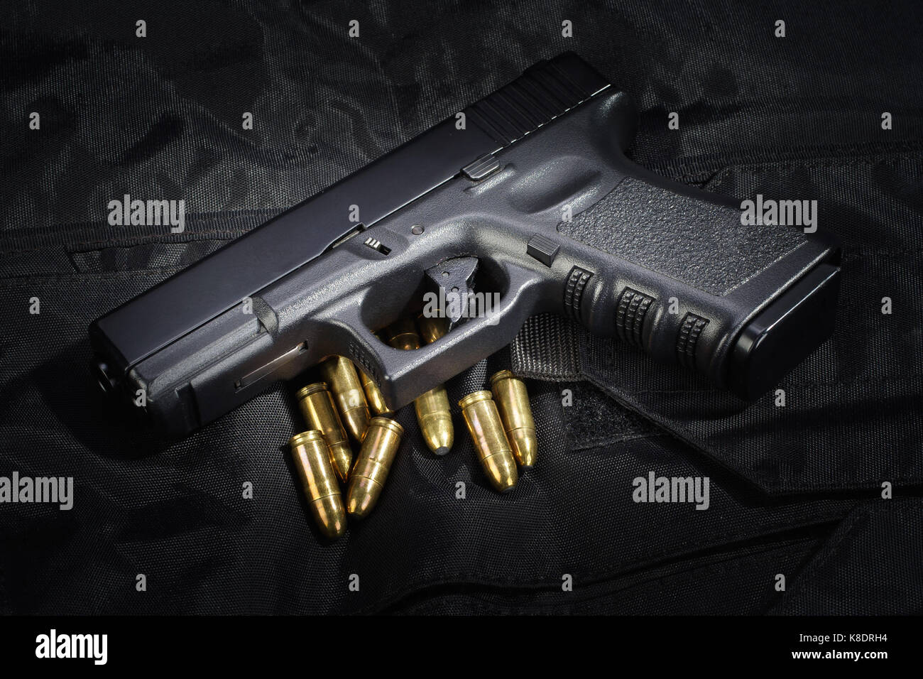 Police weapon and equipment on black uniform background Stock Photo - Alamy