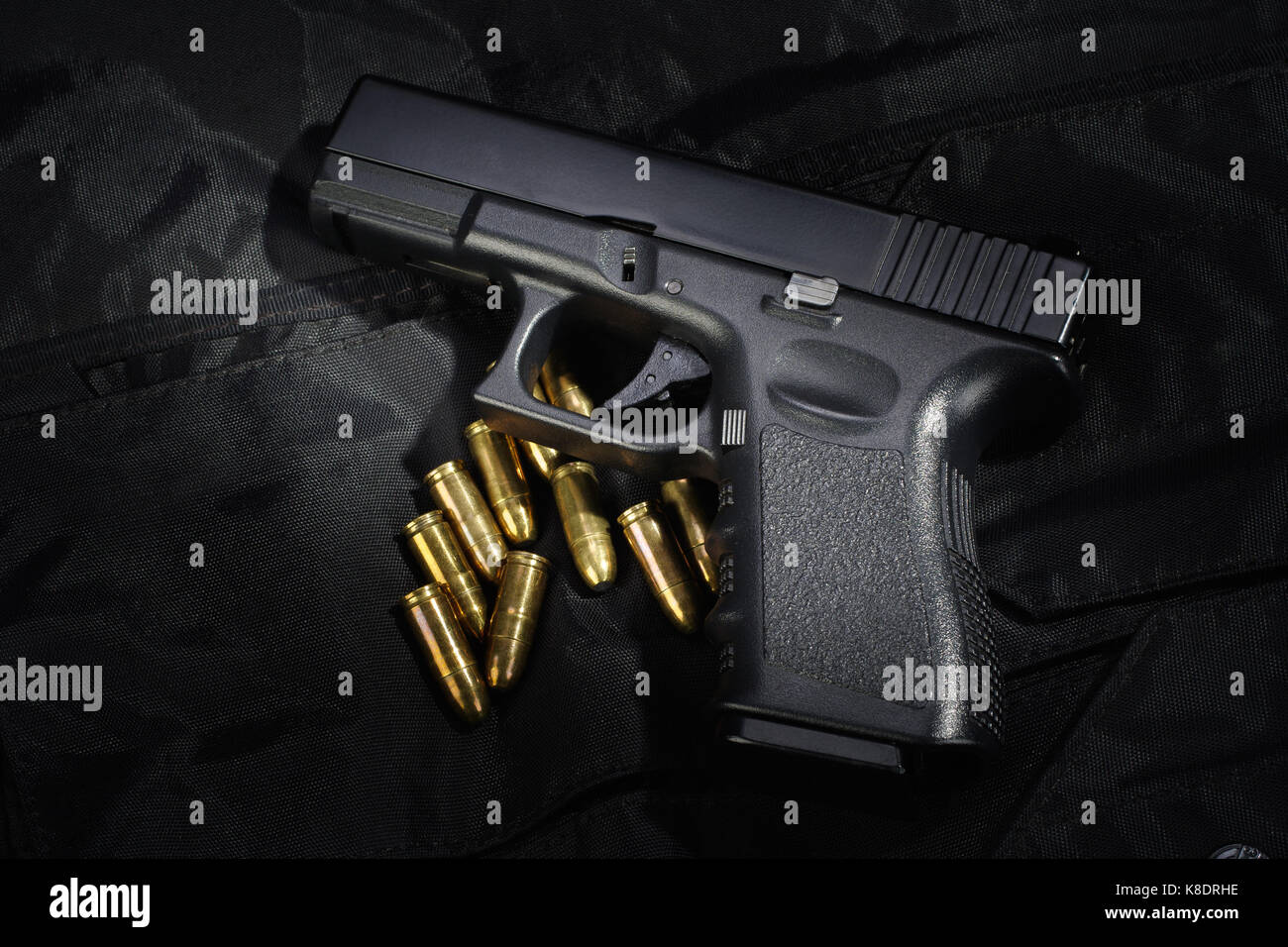 Police weapon and equipment on black uniform background Stock Photo - Alamy
