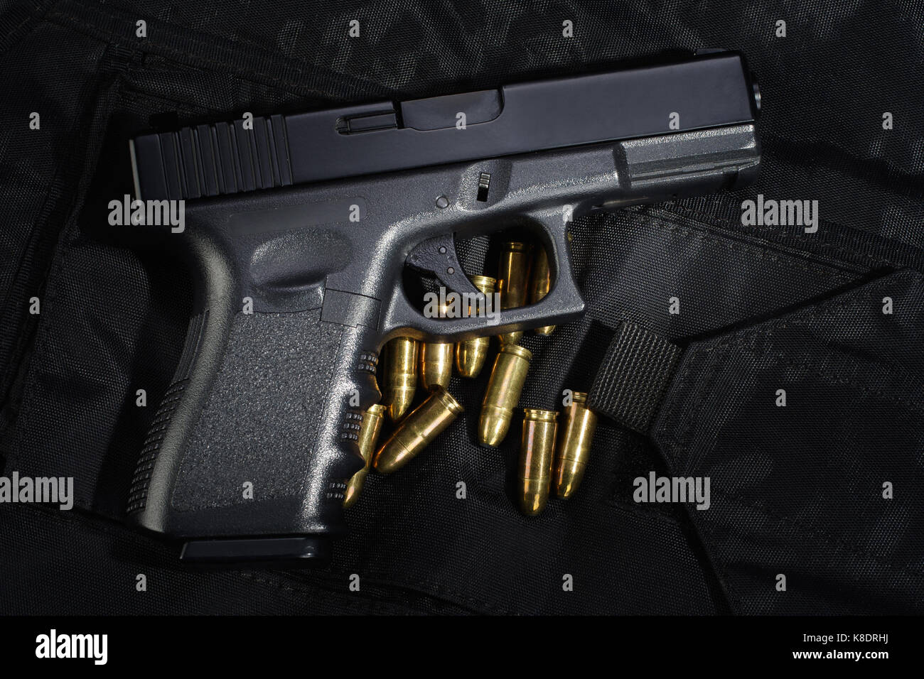 Police weapon and equipment on black uniform background Stock Photo - Alamy