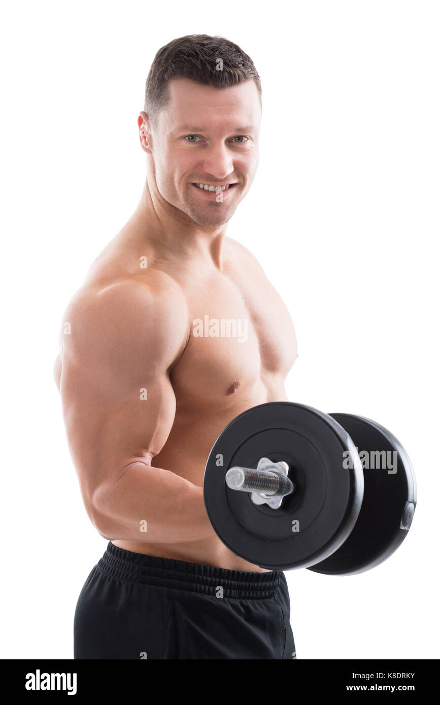 Side view portrait of happy muscular man lifting dumbbell against white ...