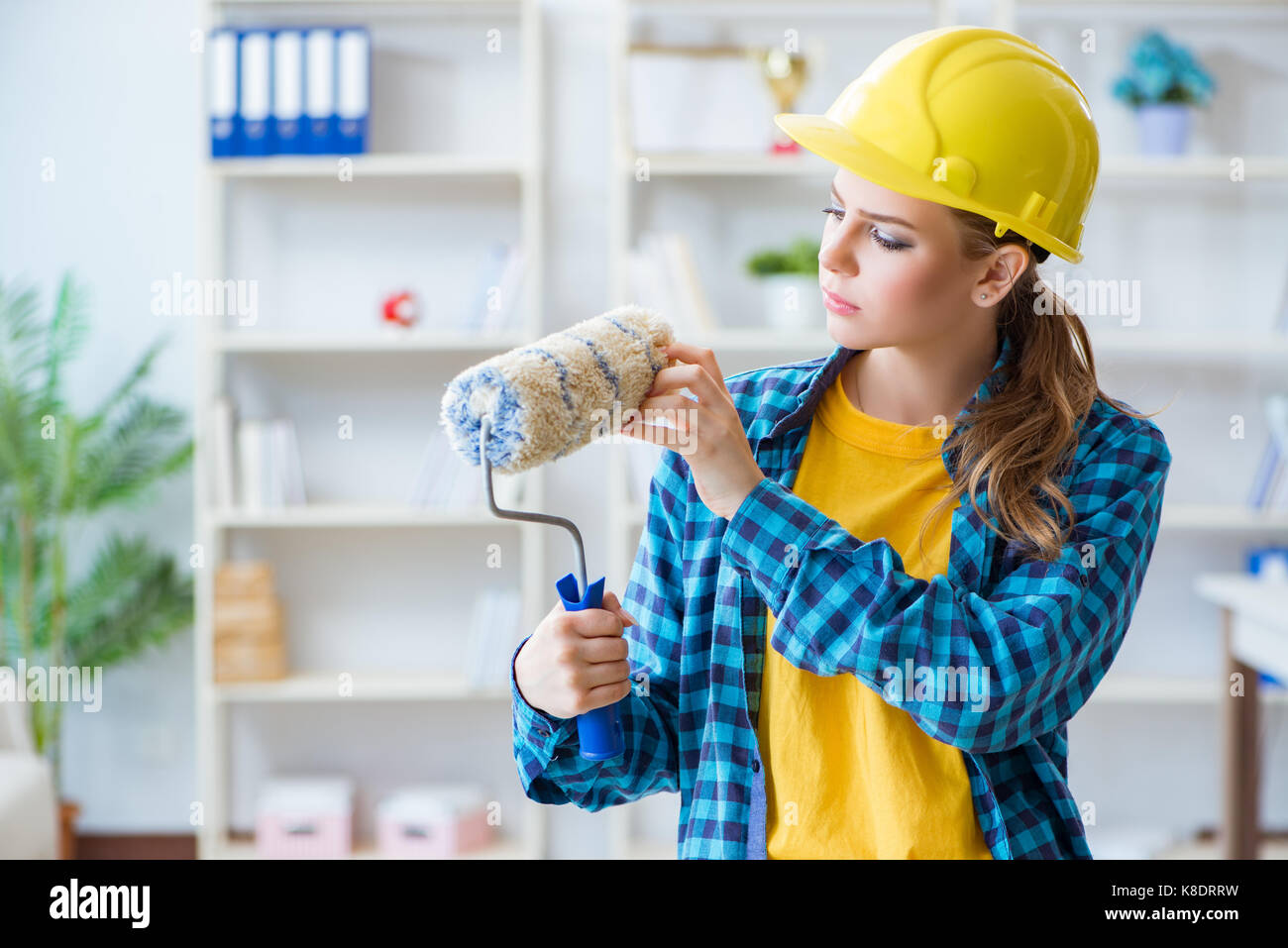 Young woman doing painting at home Stock Photo - Alamy