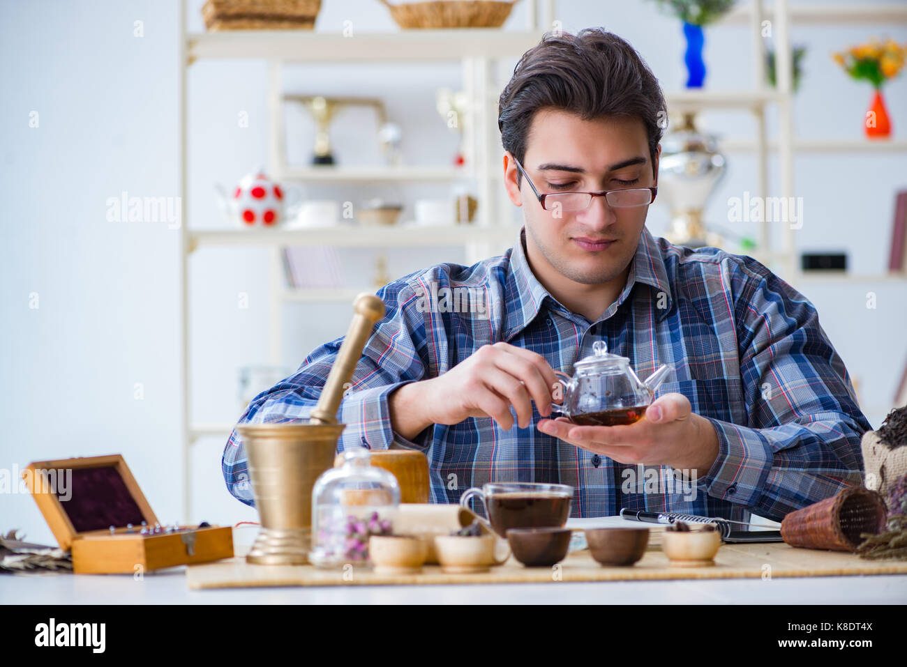 Professional tea expert trying new brews Stock Photo - Alamy