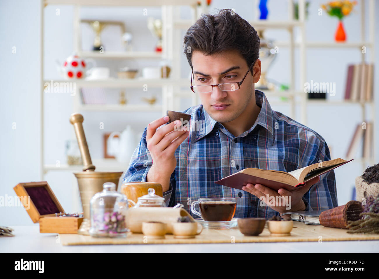 Professional tea expert trying new brews Stock Photo - Alamy