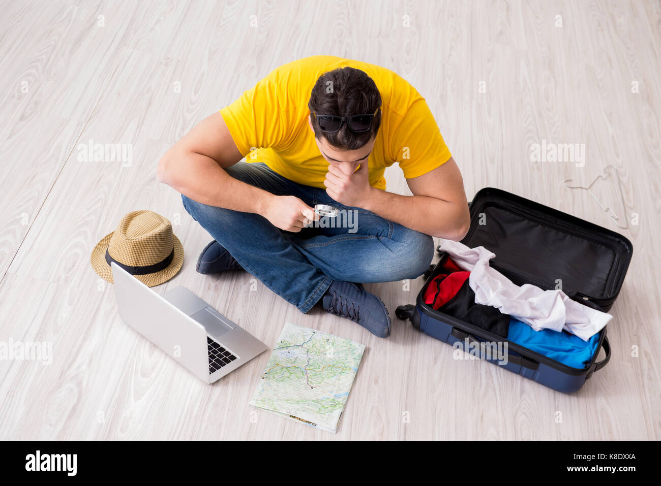 Man planning his vacation trip with map Stock Photo - Alamy