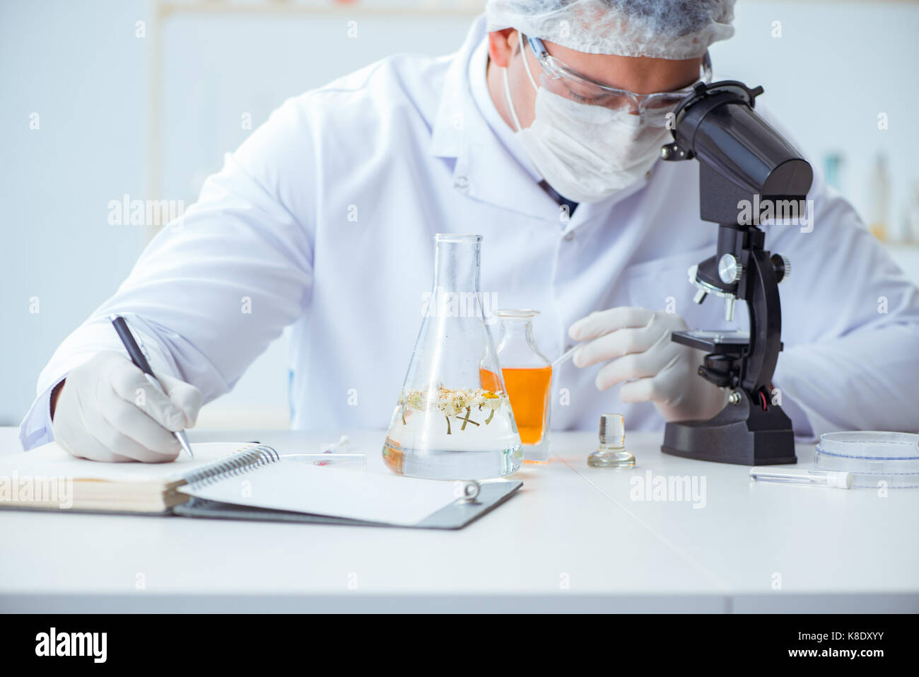 Chemist mixing perfumes in the lab Stock Photo - Alamy