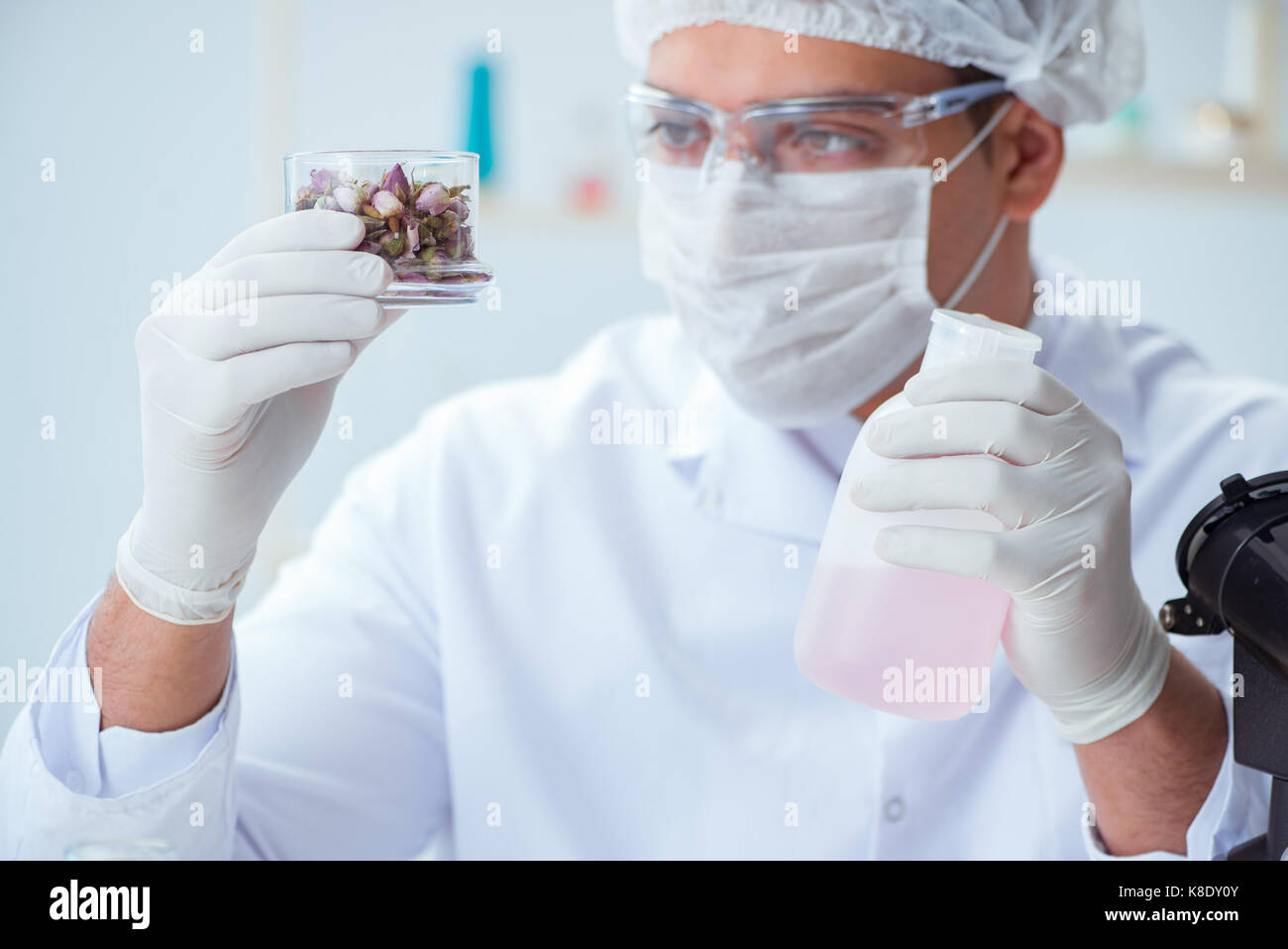 Chemist mixing perfumes in the lab Stock Photo - Alamy