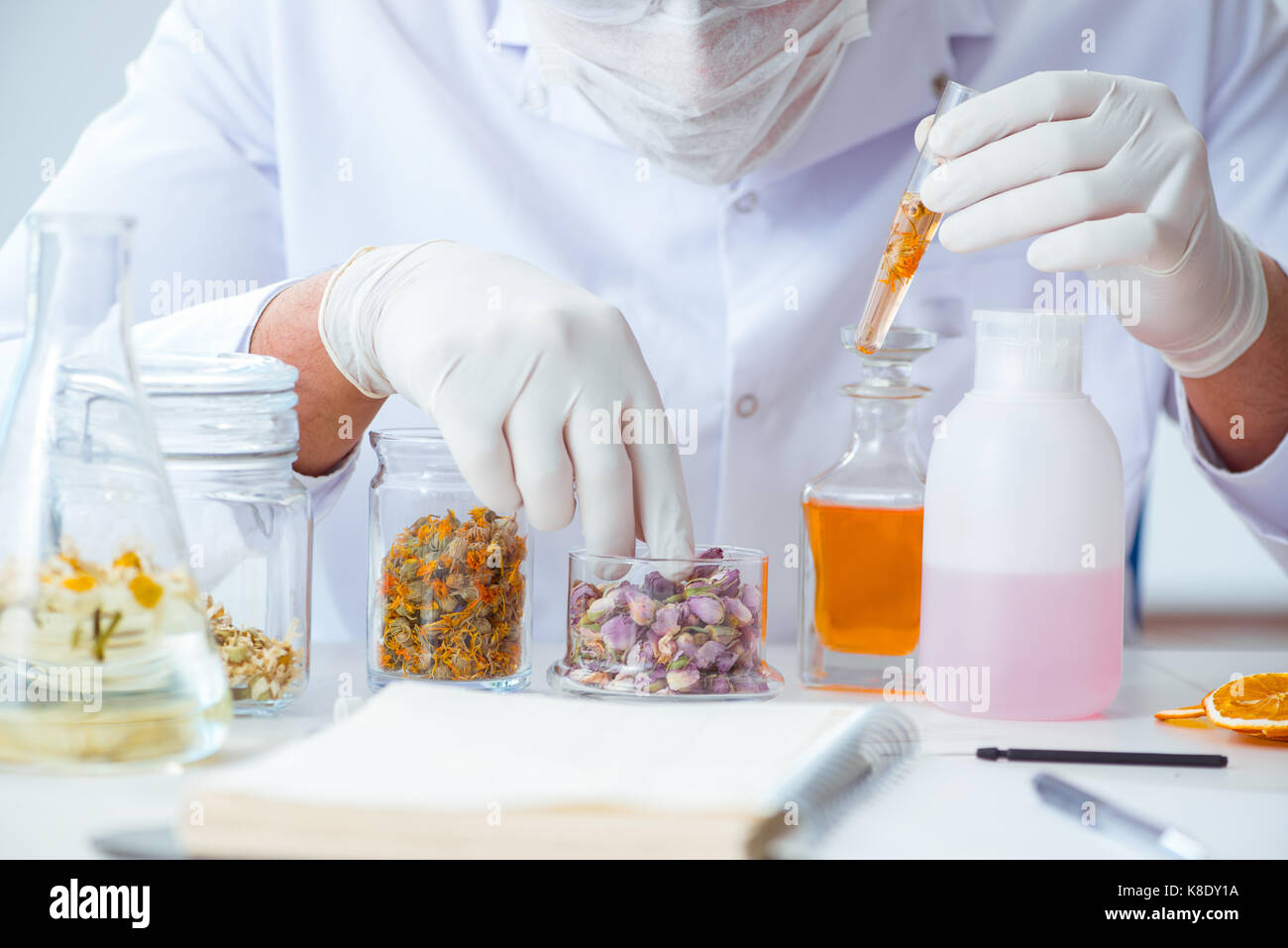Chemist mixing perfumes in the lab Stock Photo - Alamy