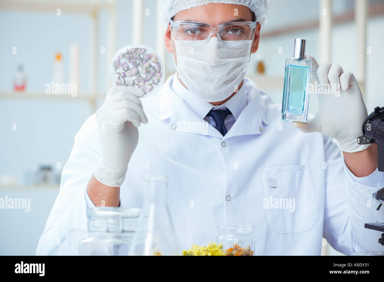 Chemist mixing perfumes in the lab Stock Photo - Alamy
