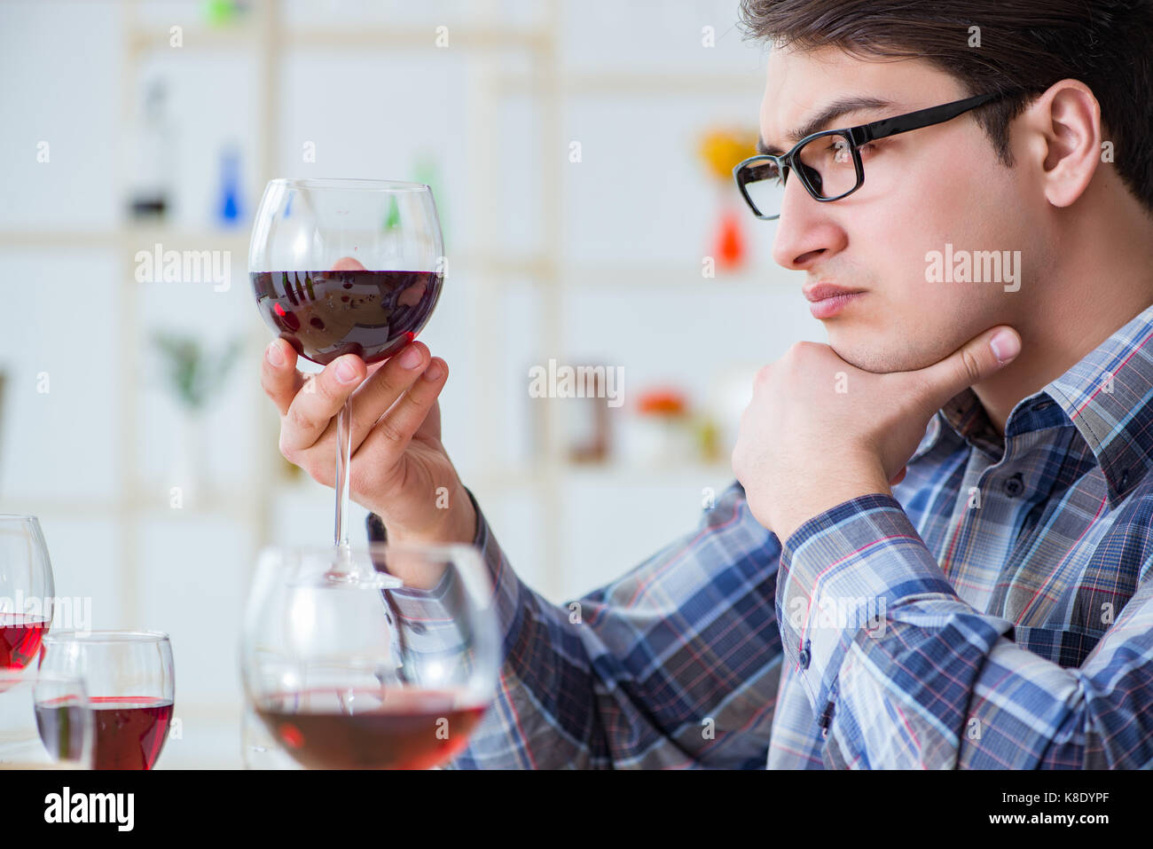 Professional sommelier tasting red wine Stock Photo - Alamy