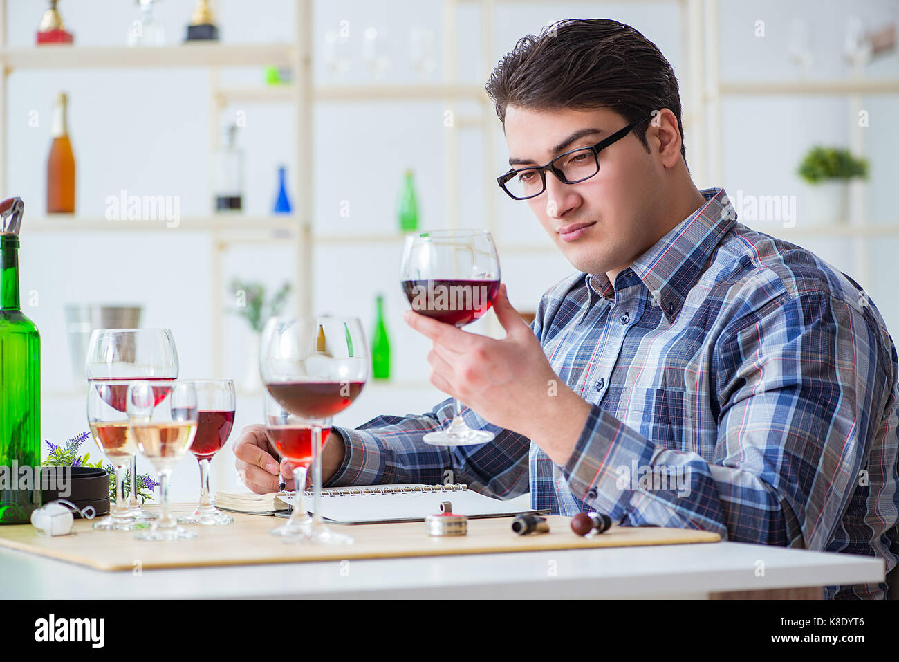 Professional sommelier tasting red wine Stock Photo - Alamy