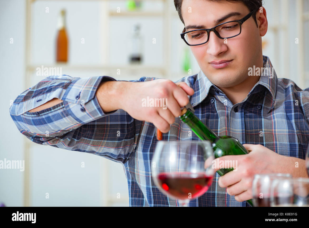 Professional sommelier tasting red wine Stock Photo - Alamy