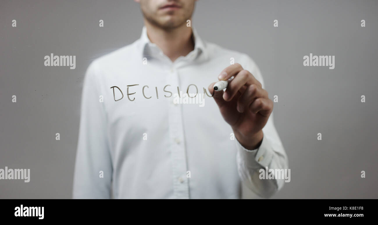 Decision, Man Writing on Glass Stock Photo - Alamy