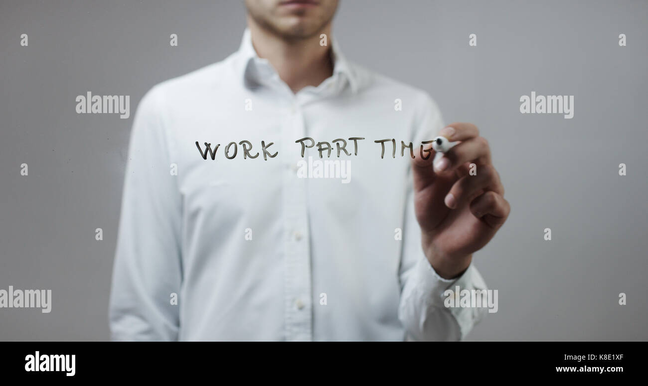 Work part time , Man Writing on Glass Stock Photo - Alamy