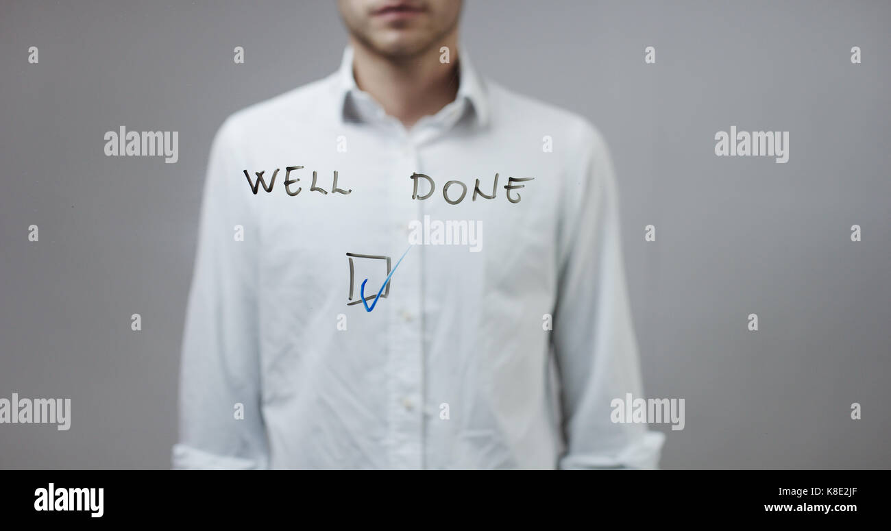 Well done, Man Writing on Glass Stock Photo - Alamy