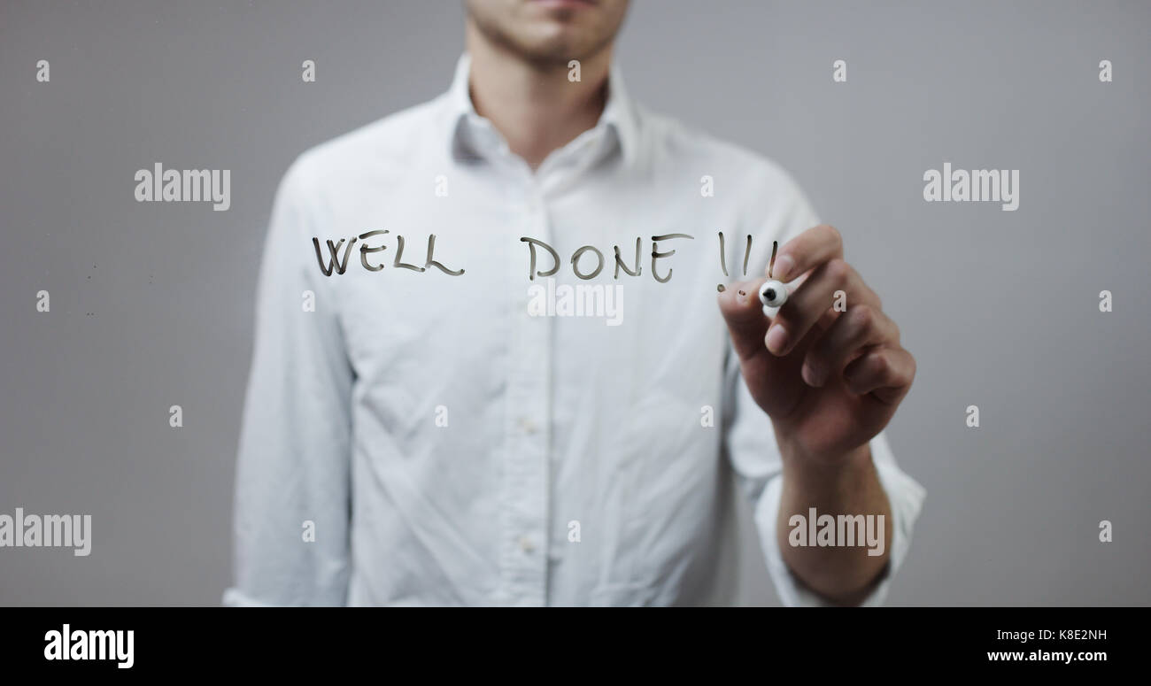 Well done, Man Writing on Glass Stock Photo - Alamy