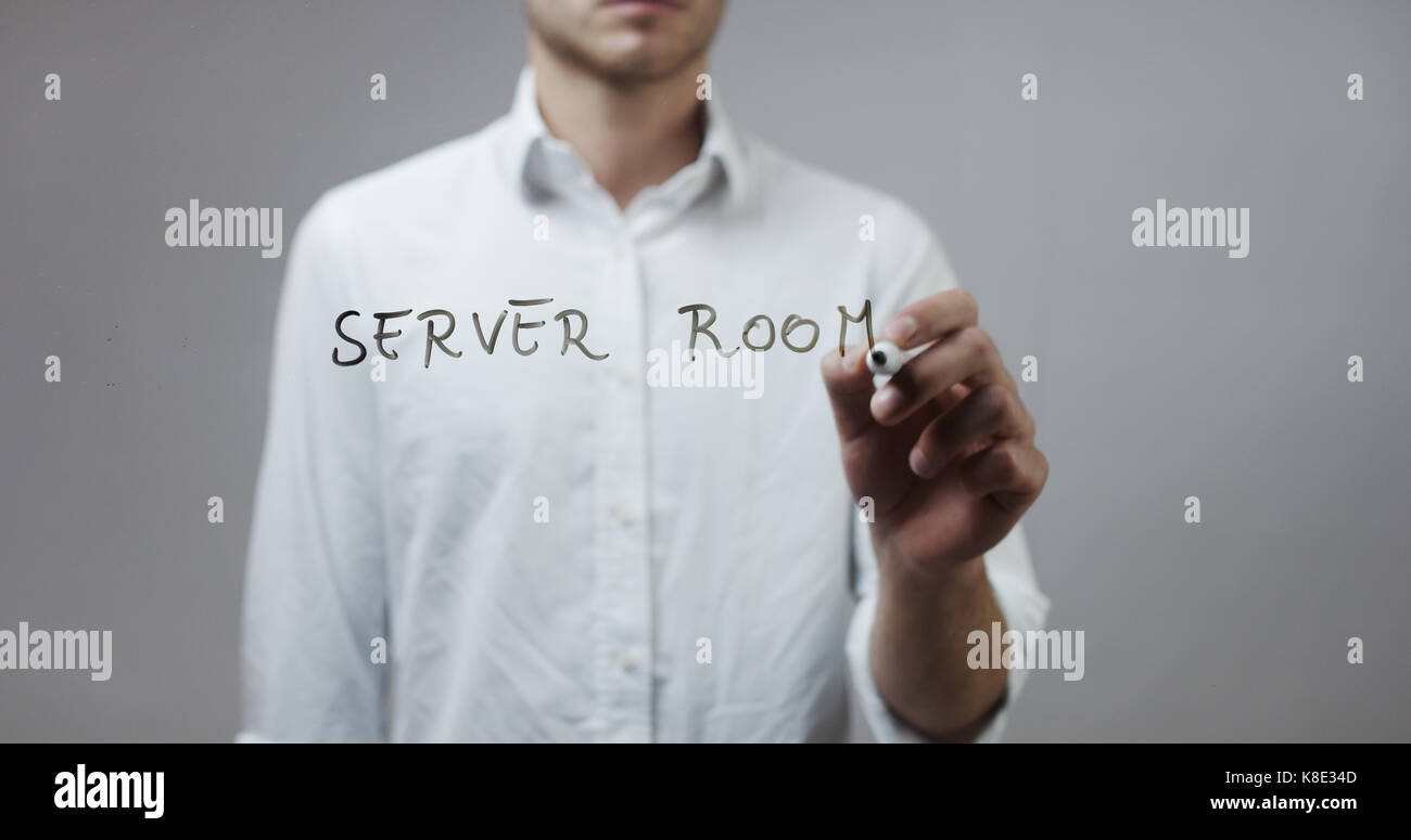 Server room , Man Writing on Glass Stock Photo - Alamy