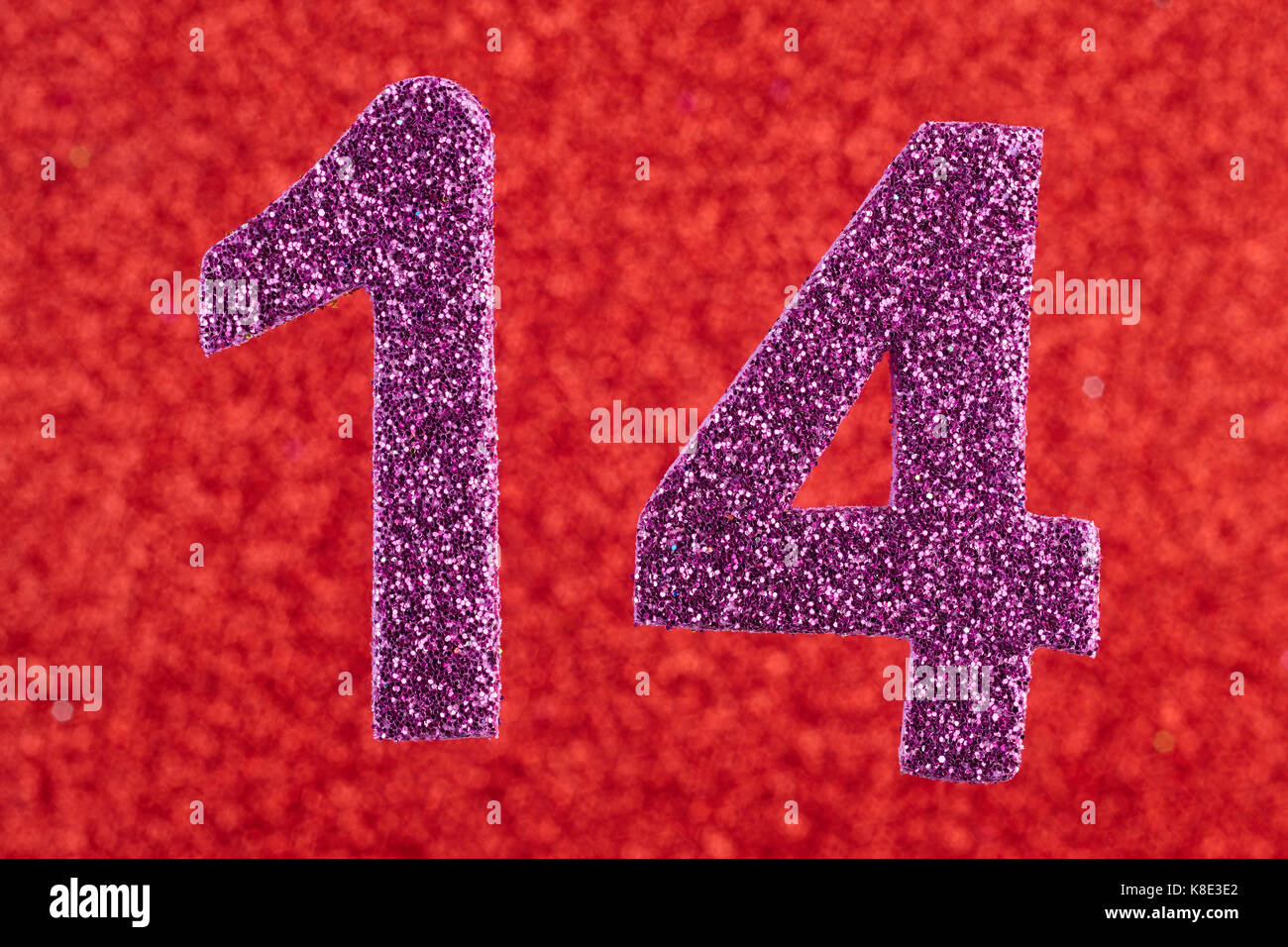 Number fourteen purple color over a red background. Anniversary ...