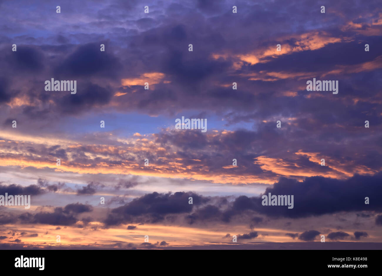 Cloudy Purple Sunset Stock Photo - Alamy