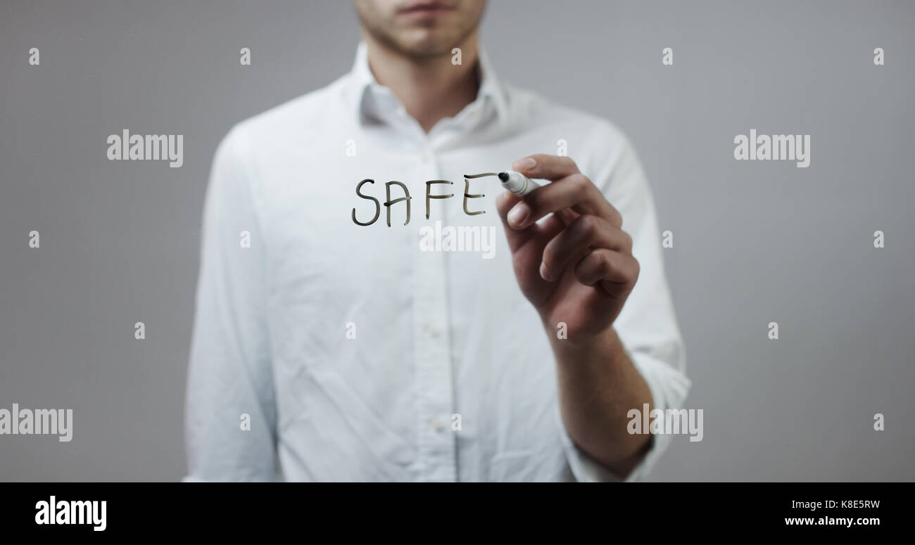 Safe , Man Writing on Glass Stock Photo - Alamy