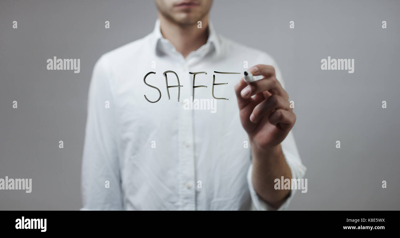 Safe , Man Writing on Glass Stock Photo - Alamy