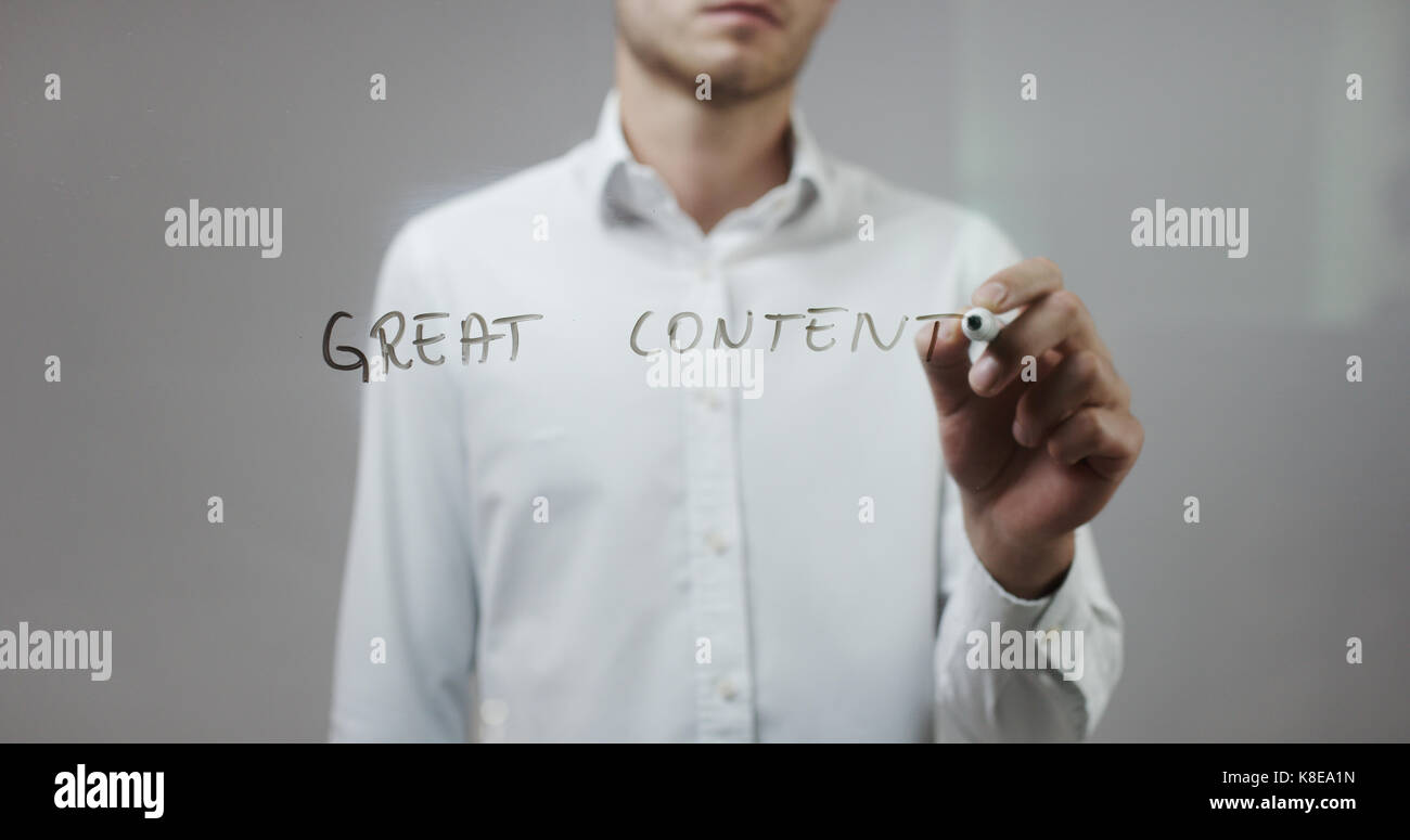 Great content, Man Writing on Glass Stock Photo - Alamy