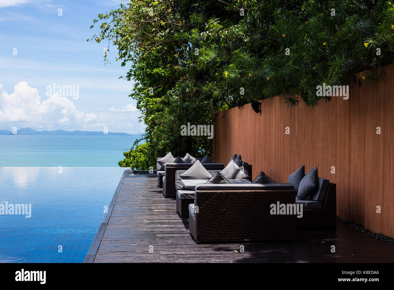sofa of outdoor restaurant at the sea view swimming pool near the sea ...