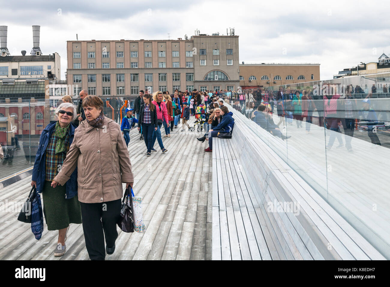 MOSCOW, RUSSIA - SEPTEMBER 16, 2017: visitors walk on floating bridge ...
