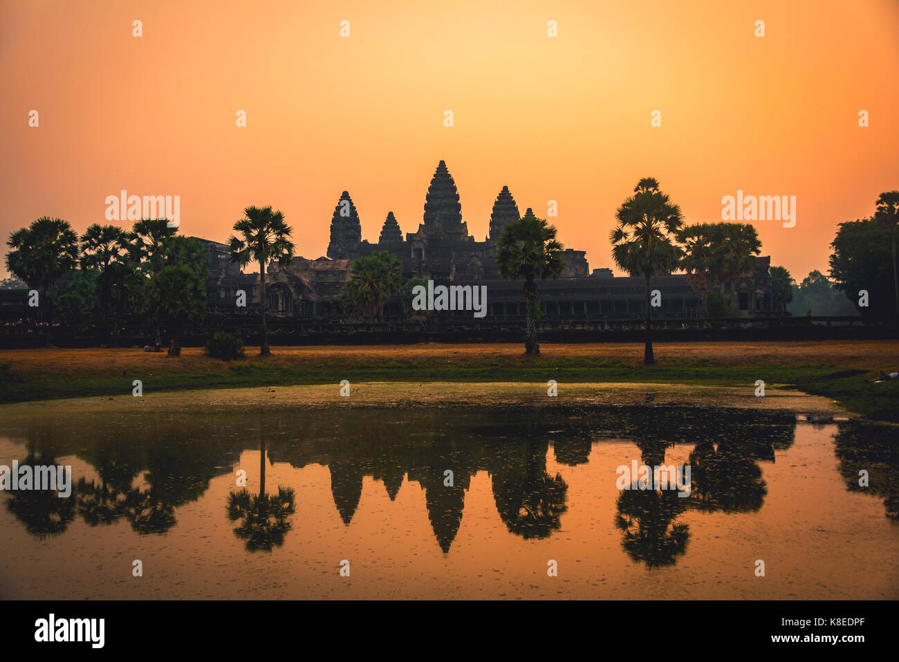 Temple complex of Angkor Wat reflected in the water basin, sunrise ...