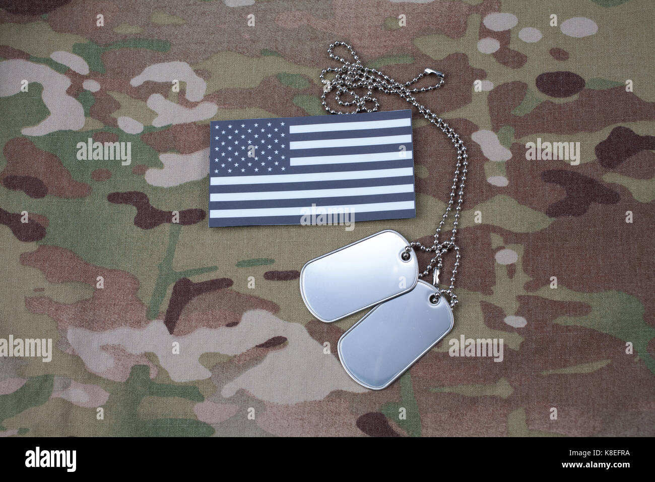 US flag patch with dog tag on multicam camouflage uniform Stock Photo ...