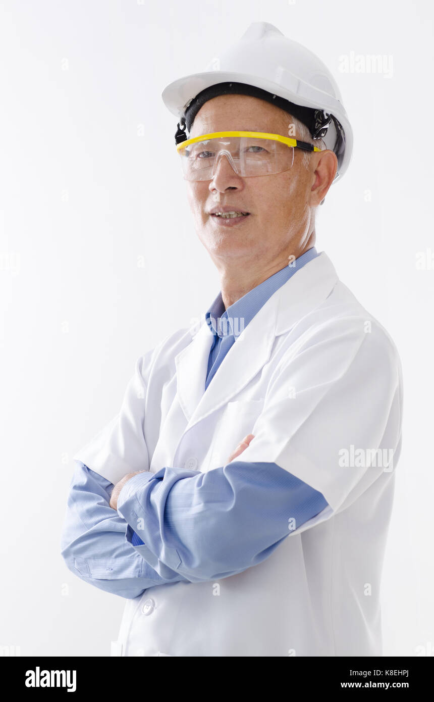 Portrait of Asian senior engineer with hard helmet and uniform ...